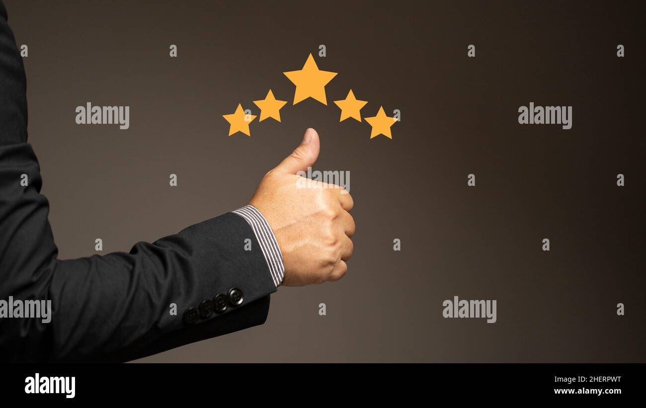 The businessman gave a thumbs up for his satisfaction rating. Service ...