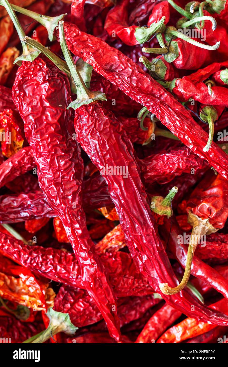 Dry red hot chilli peppers macro background Stock Photo - Alamy