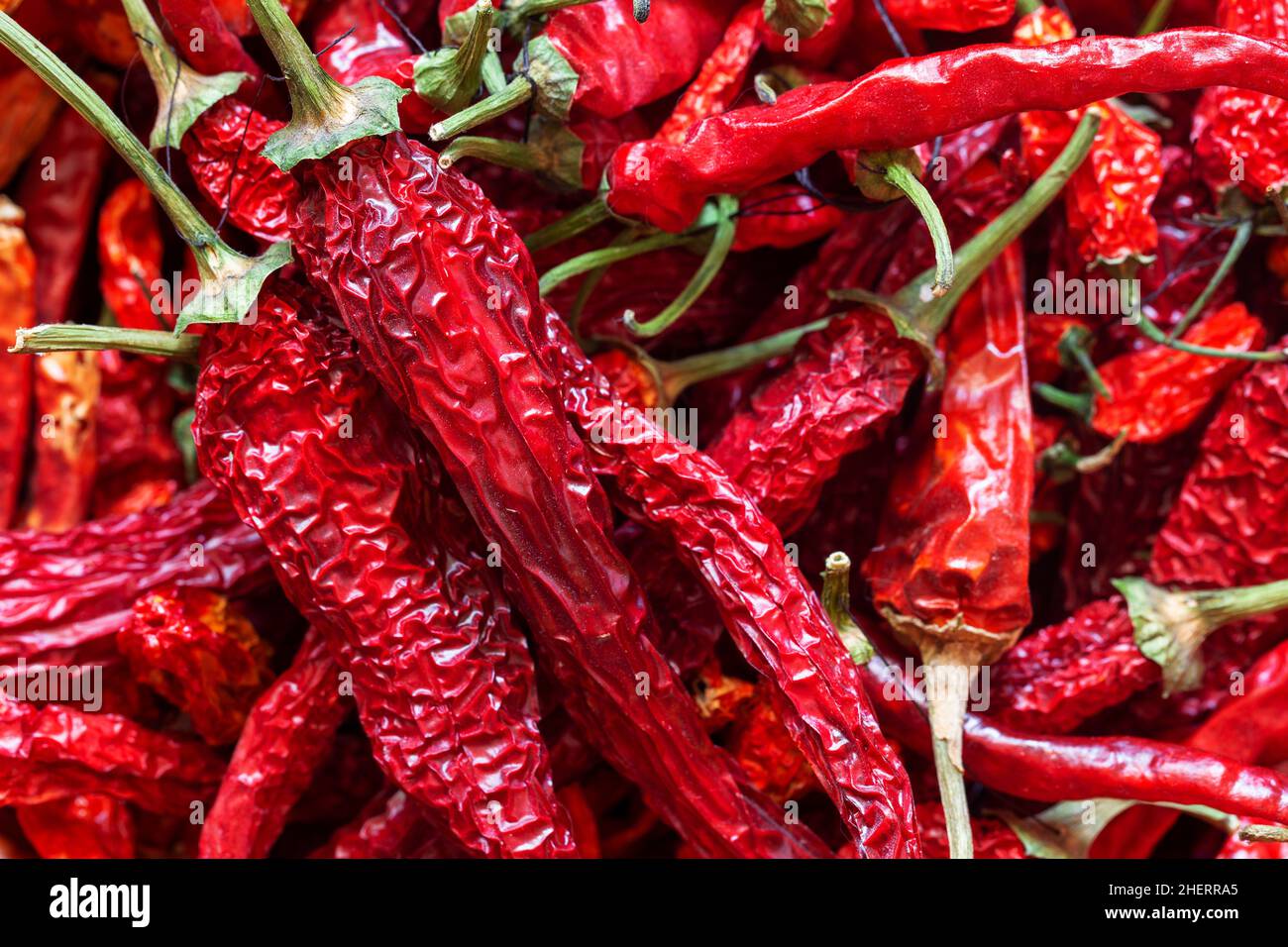 Red hot chilly peppers background. Spicy food Stock Photo - Alamy