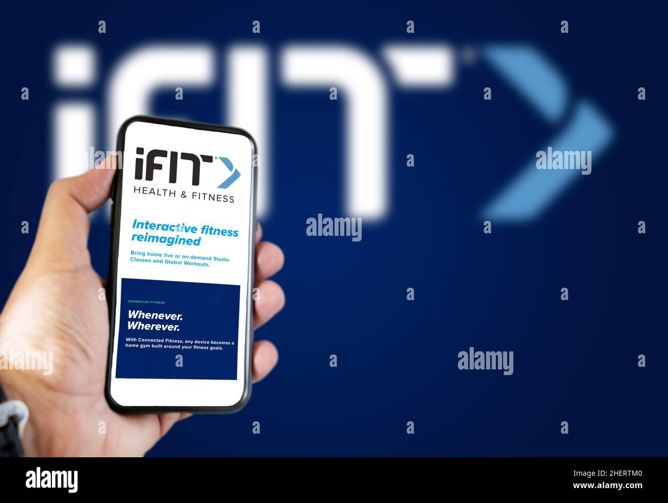 New York, USA, September 2021: hand holding a phone with the iFit ...