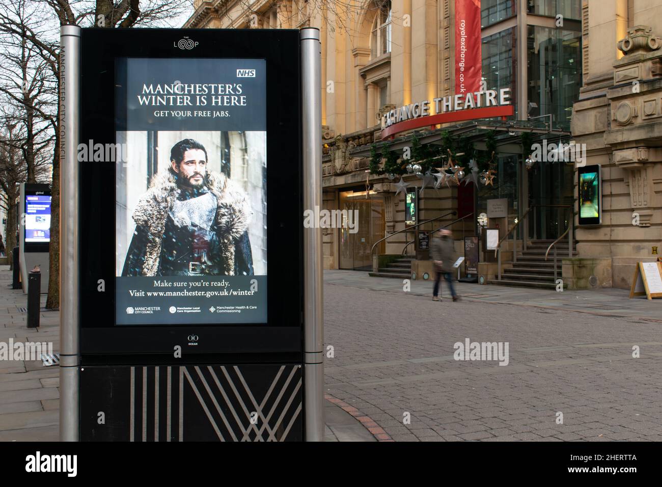 Loop advert for free NHS jabs in winter outside the Royal Exchange ...