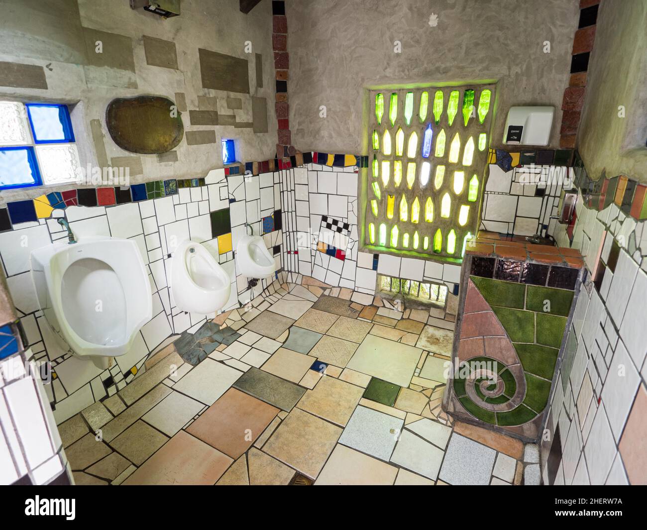 Urinal with ceramic tiles in the public toilet of the artist and ...