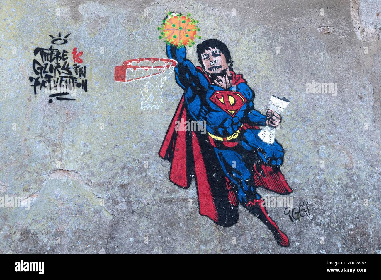 Superman plays basketball with a virus, graffiti on a wall, Lauf an der ...