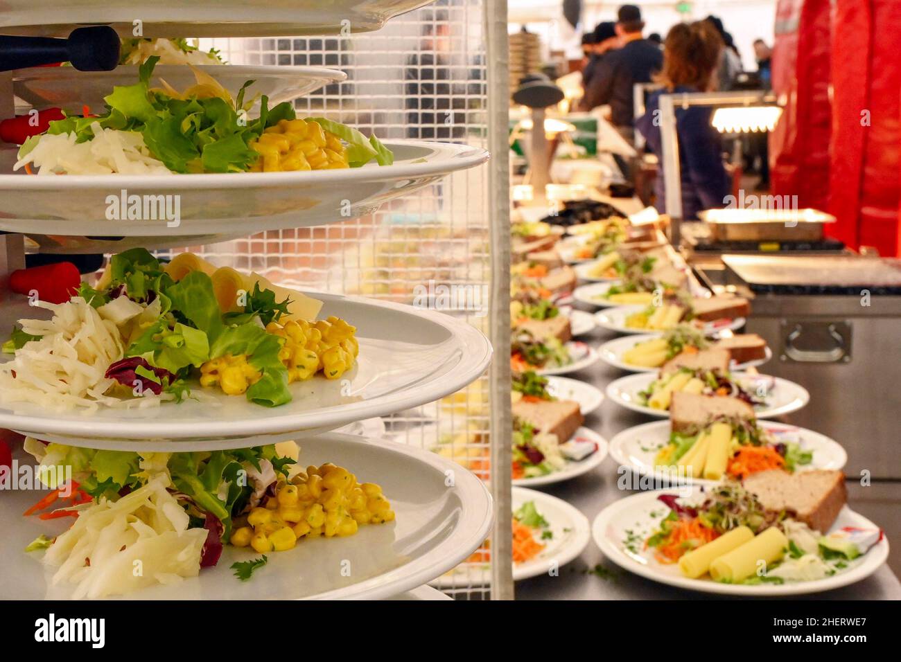 Stacked plates of mixed salad with sliced cheese and sprouts Stock ...