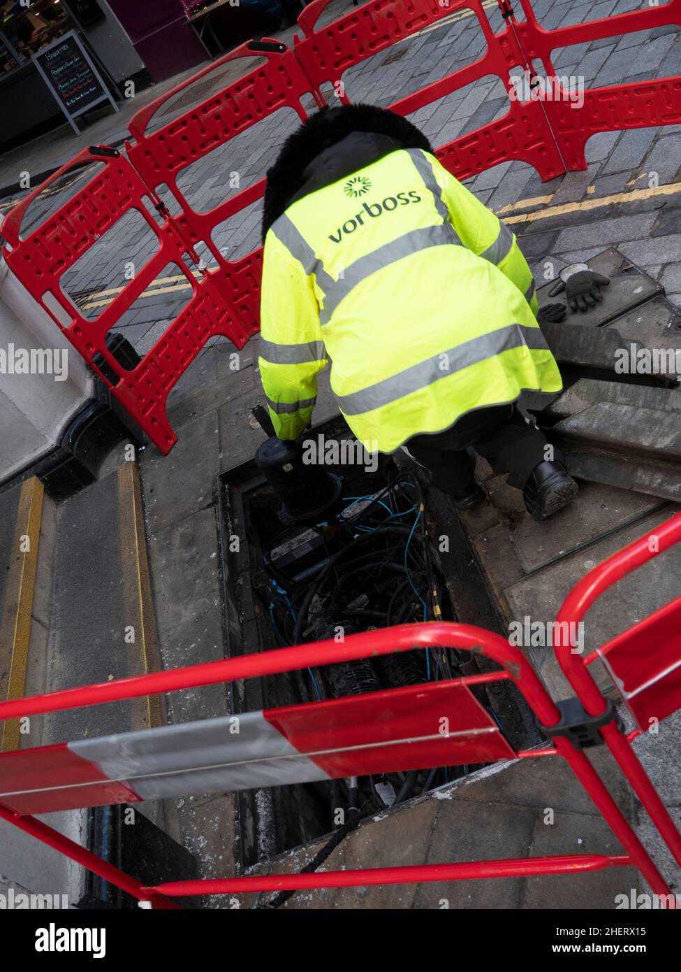 Vorboss engineers fitting cables behind street barriers for Vorboss ...