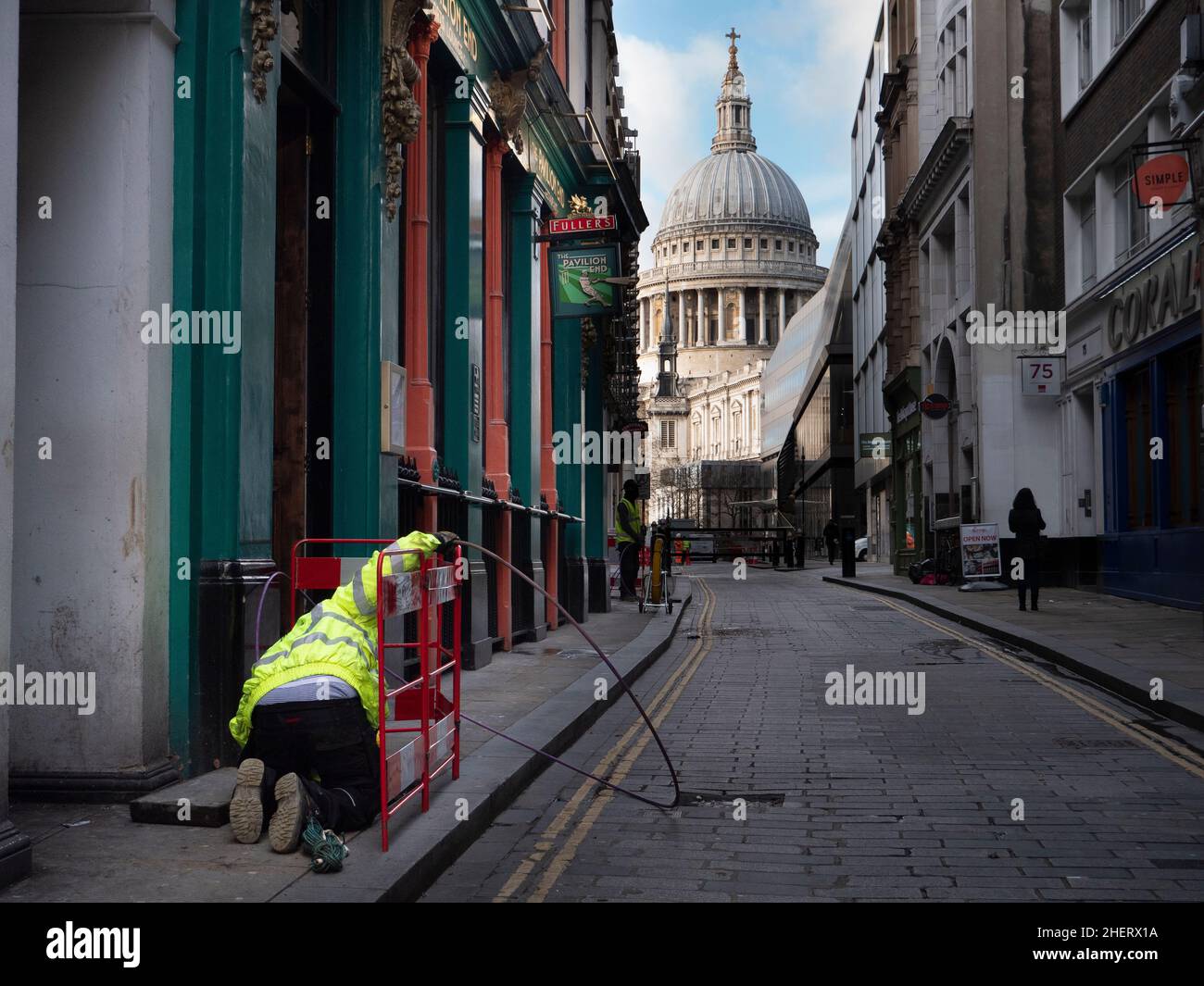 Vorboss engineers fitting cables behind street barriers for Vorboss ...