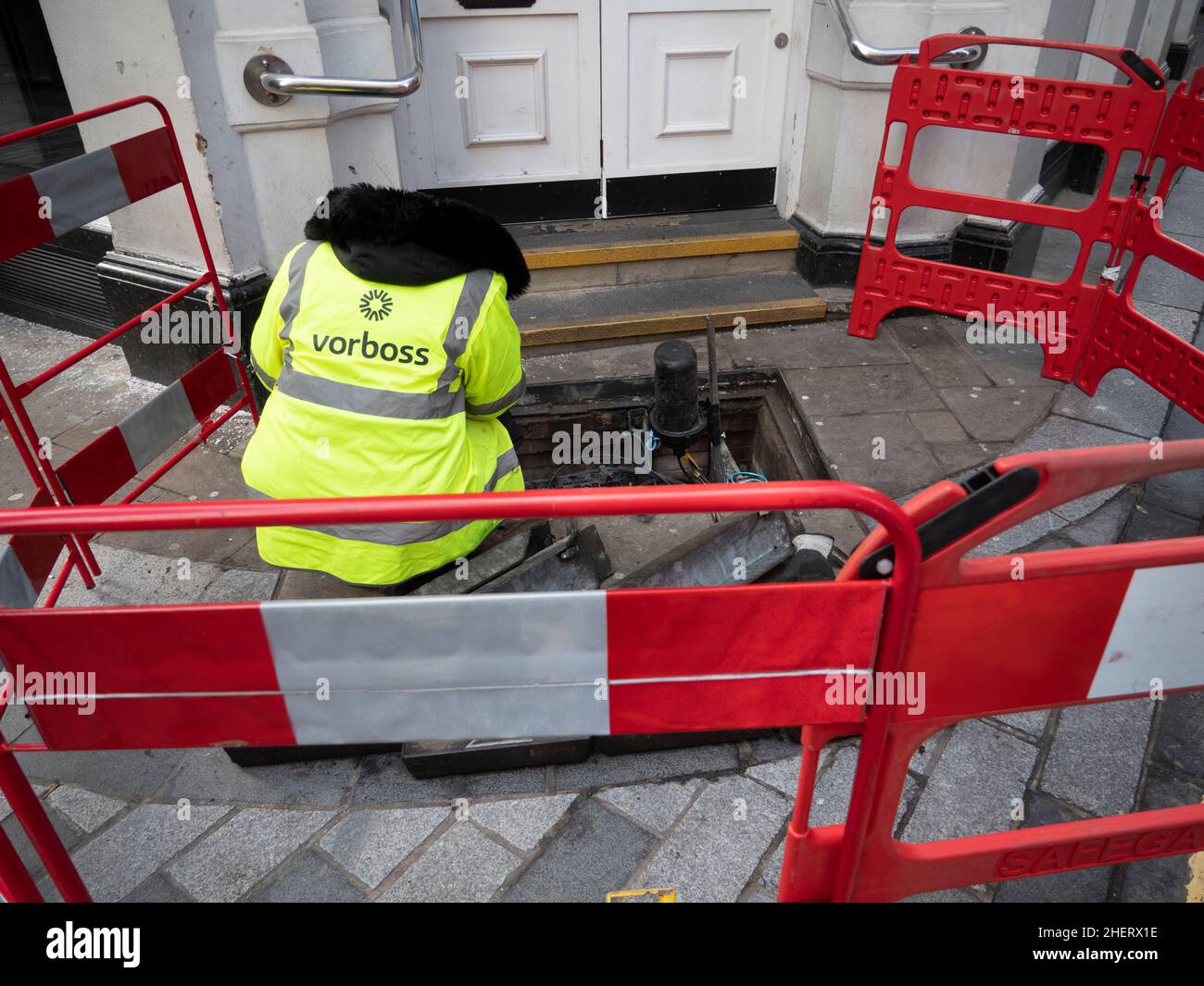 Vorboss engineers fitting cables behind street barriers for Vorboss ...