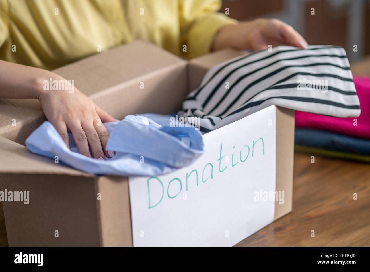 Hands sorting hi-res stock photography and images - Alamy