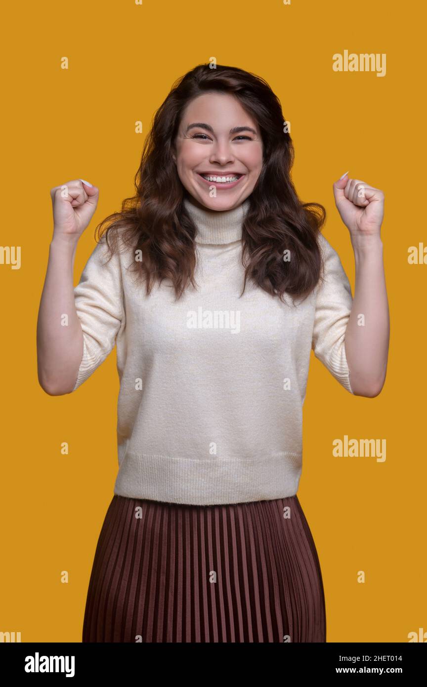 Joyful trendy lady demonstrating her energy before the camera Stock ...