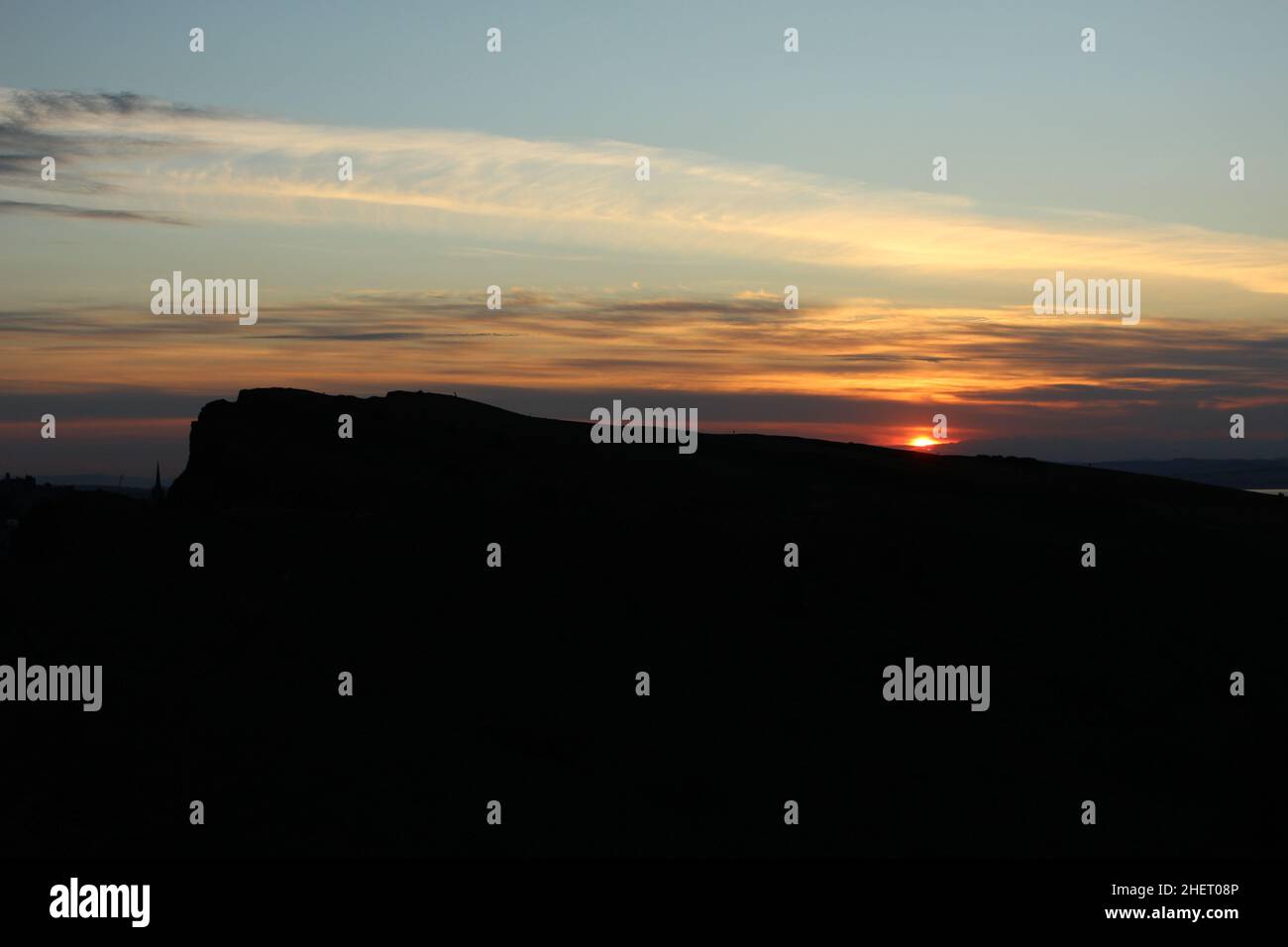 Sunset over Arthur's Seat (Edinburgh, Scotland, UK). Glowing orange ...