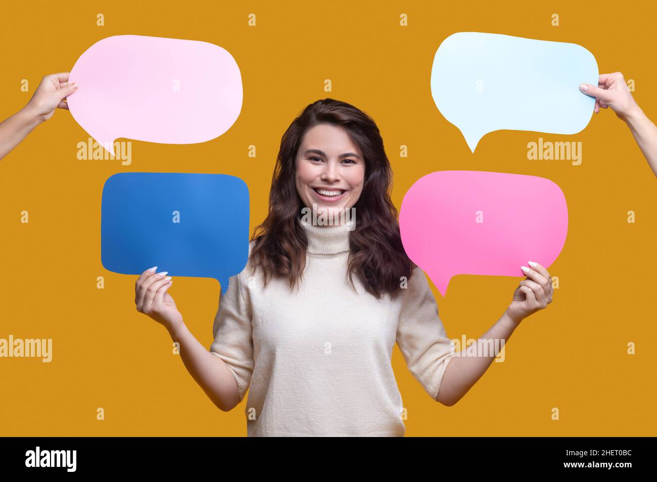Smiling female demonstrating empty question and answer signs Stock ...
