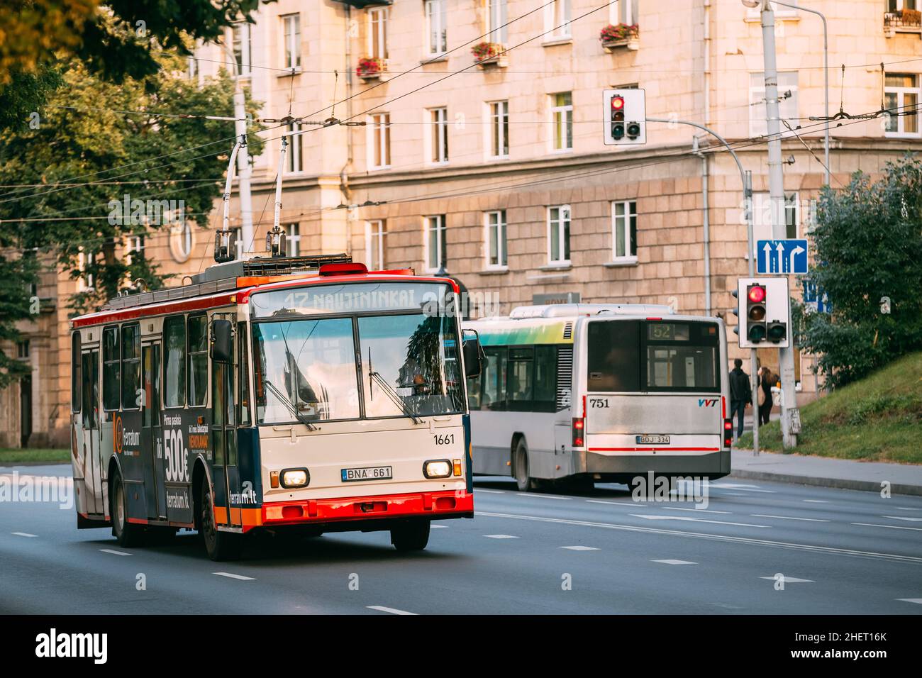 Vilnius, Lithuania. Two City Trolleybuses Moving On Wide Street In ...