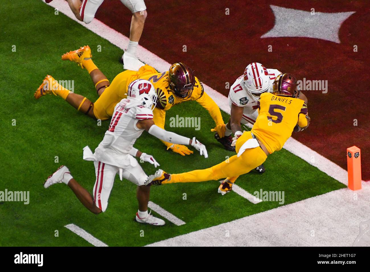 Arizona State Sun Devils quarterback Jayden Daniels (5) dives for the ...