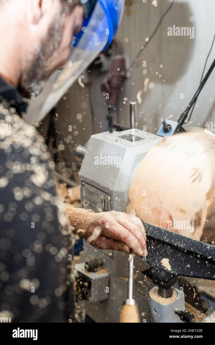 man wood work with mortise chisel a rotating pice of timber Stock Photo ...