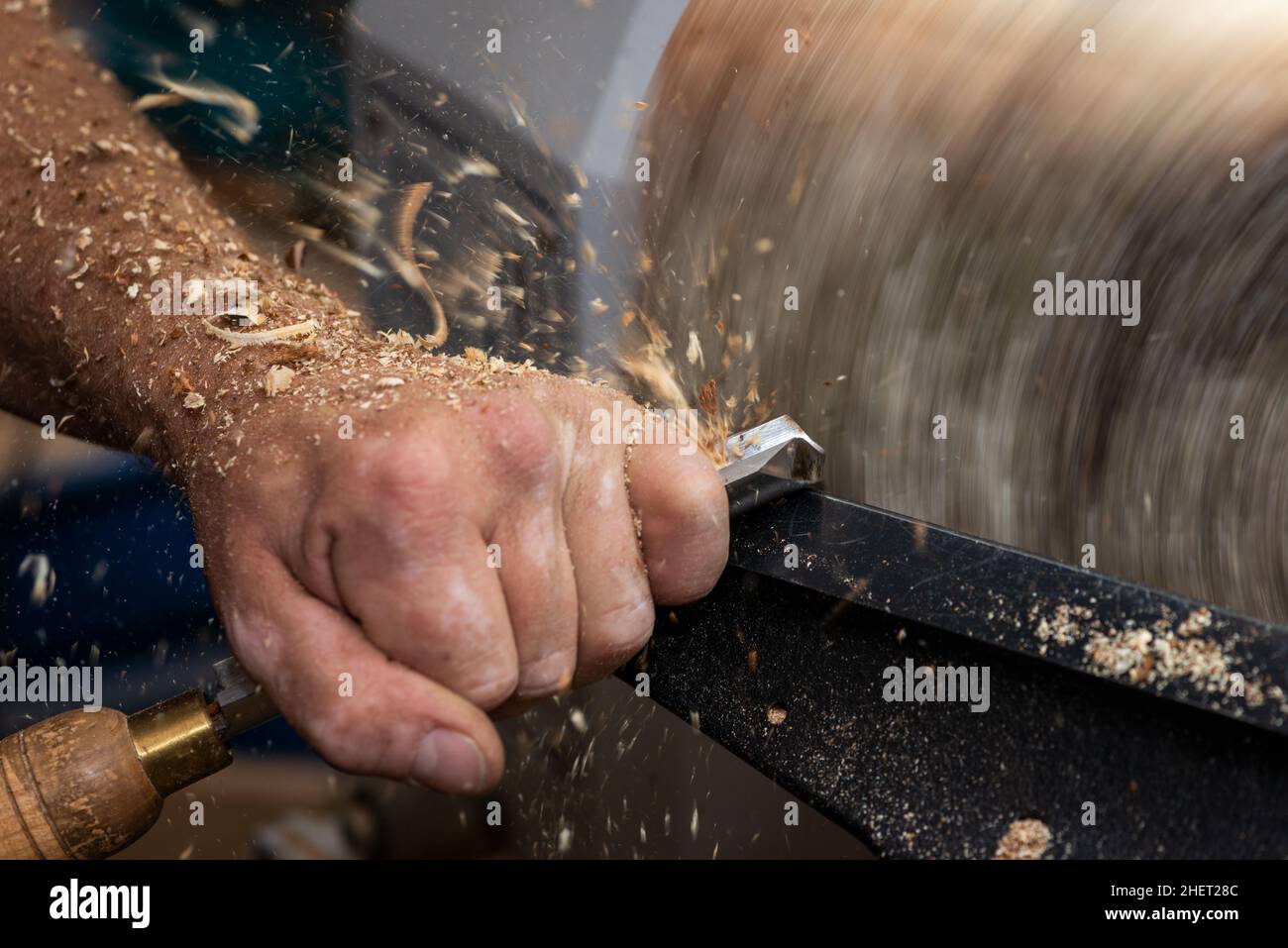 wood in rotating motion while cutting and carving a timber bowl Stock ...