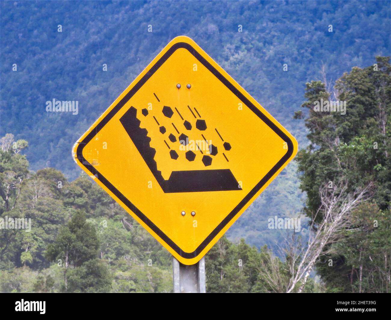 warning sign rockfall with blue sky in background, Patagonia Stock ...