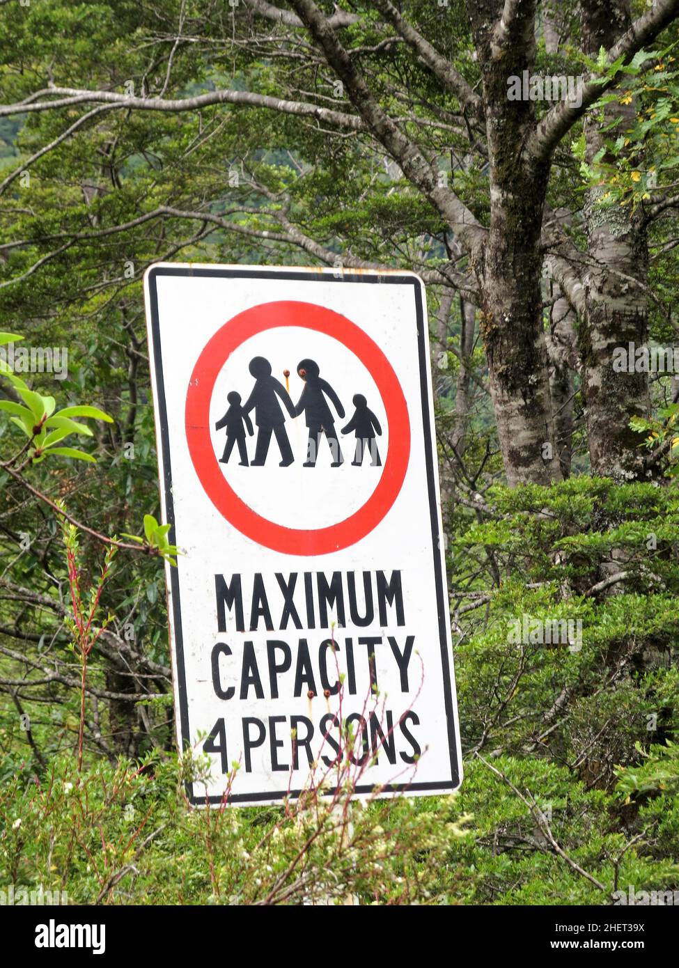 warning sign at a small bridge indicating only 4 people at the bridge ...