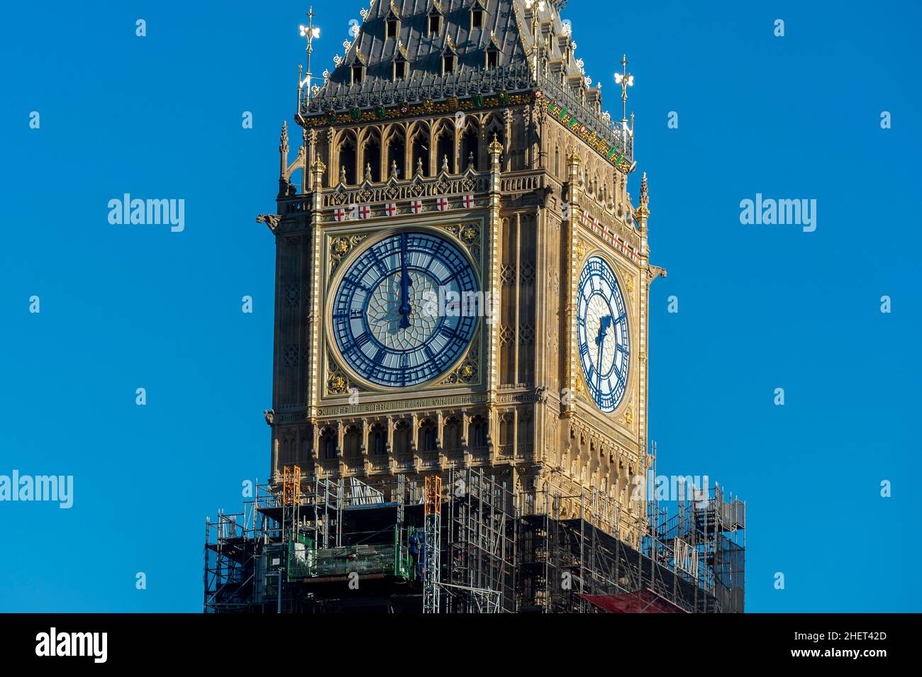 London, UK. 12 January 2022. The clock faces on the Elizabeth Tower ...