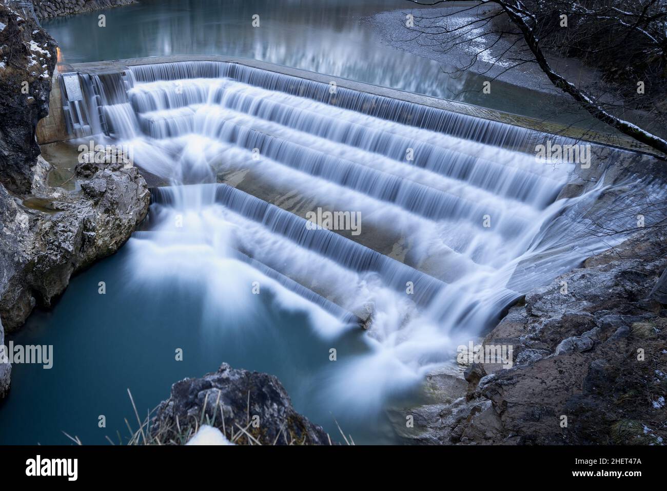 water in motion flowing over fall with steps at winter Stock Photo - Alamy