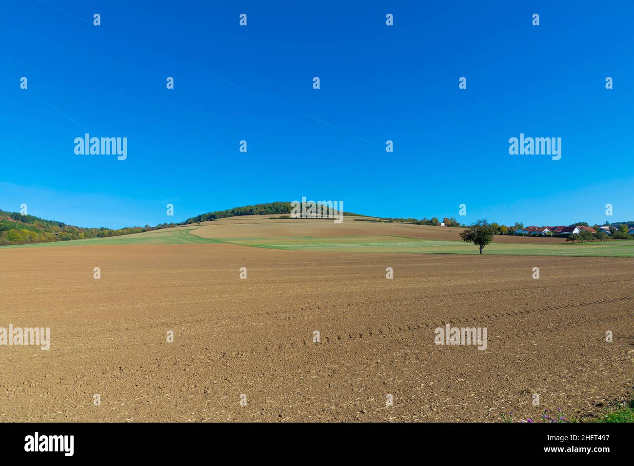 rural landscape with new plowed fields at the romantic street near ...