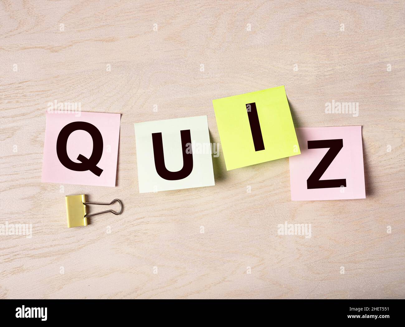 Word quiz on colorful sticky notes on wood desk Stock Photo - Alamy