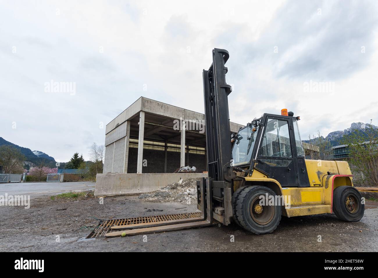 yellow pallet lift truck transporter standing at storehouse Stock Photo ...