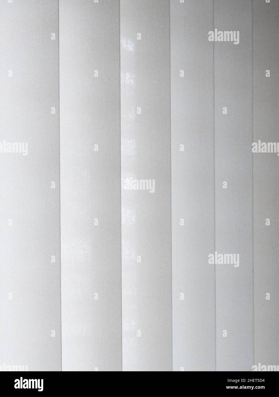 closed shutter of a curtain in grey color gives a harmonic background ...