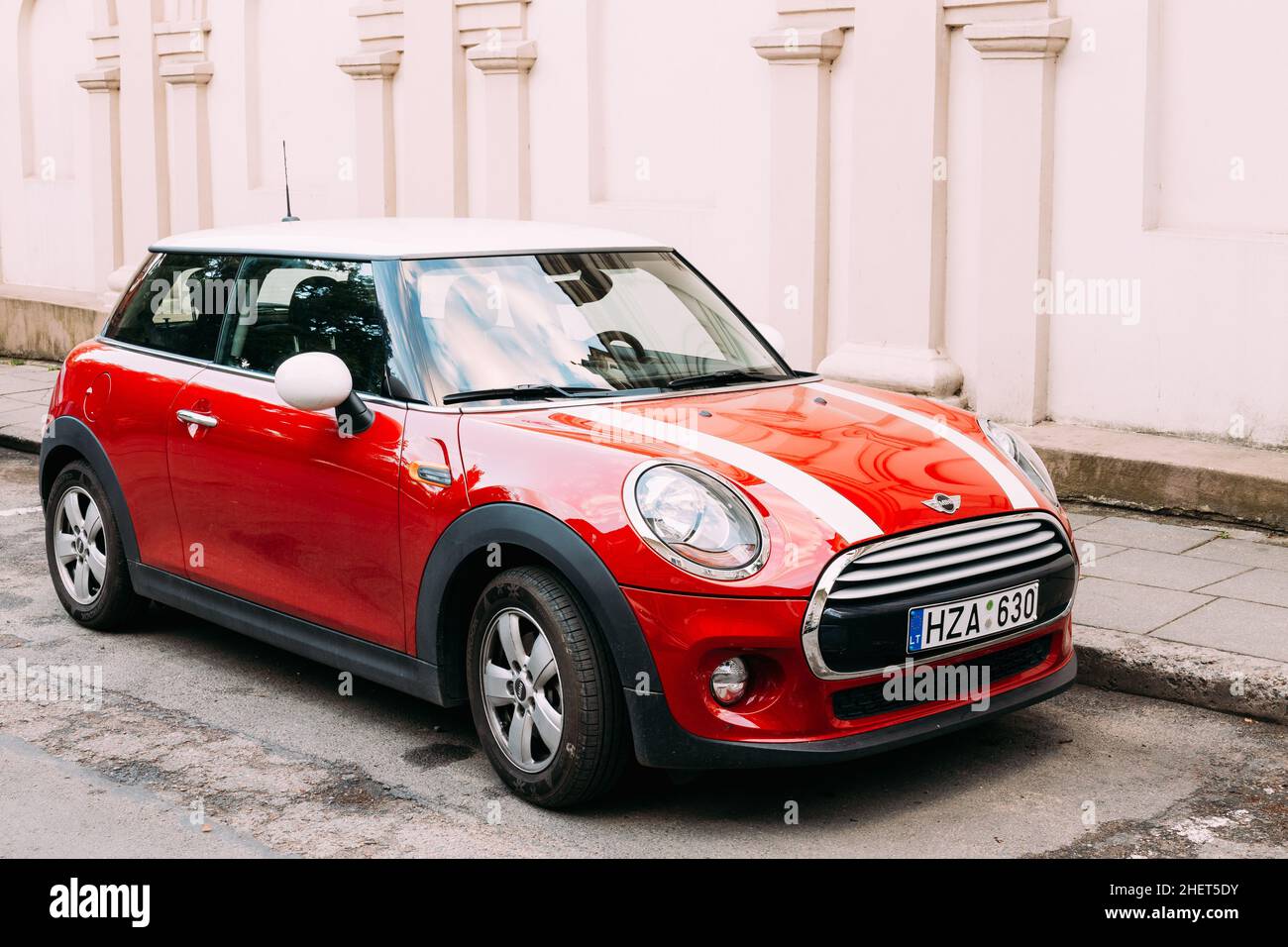Red Color Car With White Stripes Mini Cooper Parked On Street In Old ...