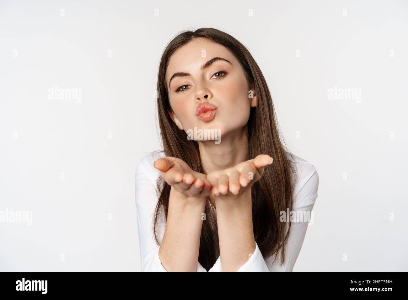 Feminine Woman Sending Air Kiss At Camera Coquettish Flirty Pose