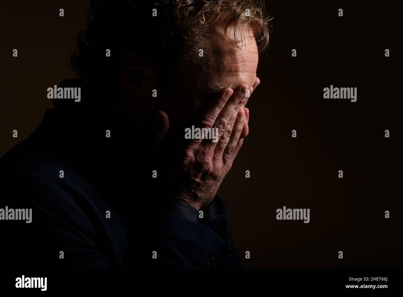 Portrait of a beautiful happy man in front of a colored background ...