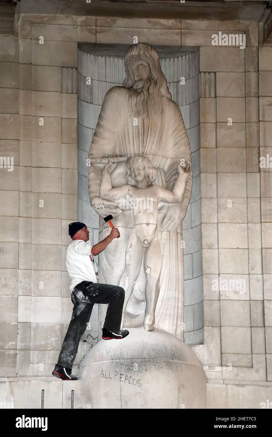 A man after he climbed onto the statues Prospero and Ariel from ...