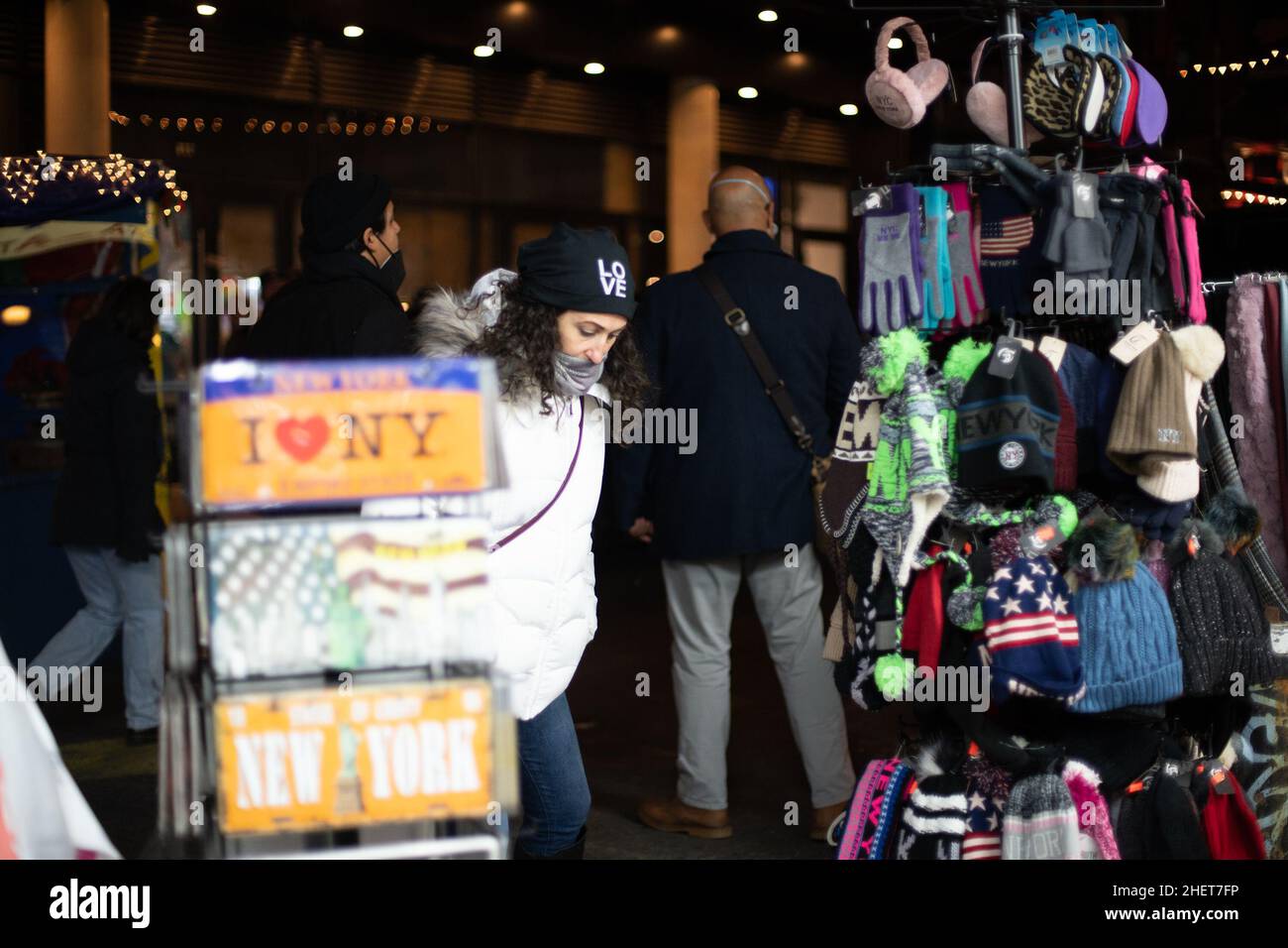 Woman stands outside retail store in New York's chinatown Stock Photo ...