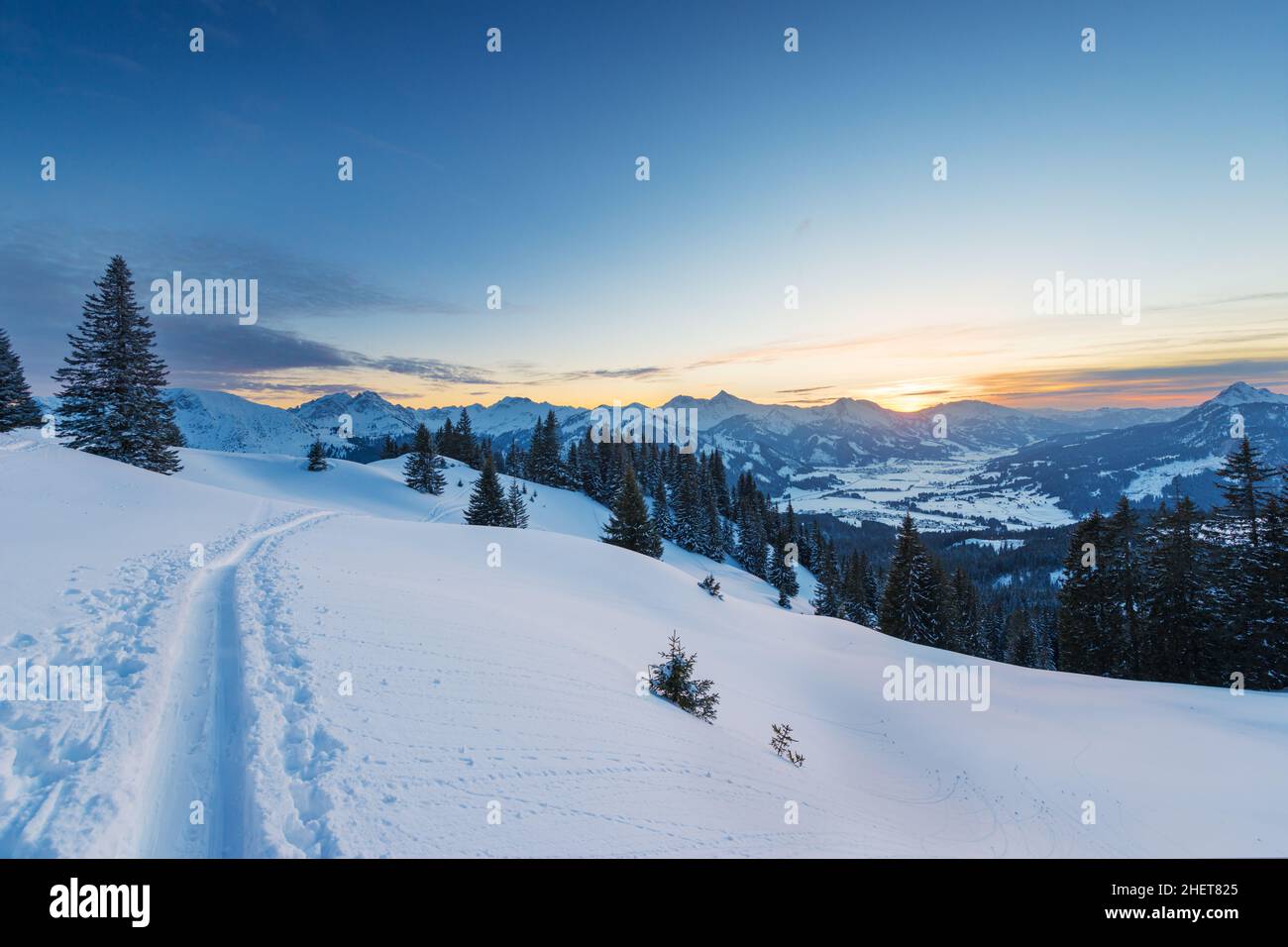 ski snow tracks in austrian mountains at winter sunset Stock Photo - Alamy
