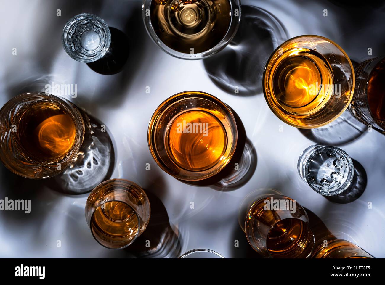 Strong drinks, spirits and distillates in glasses: cognac, grappa ...