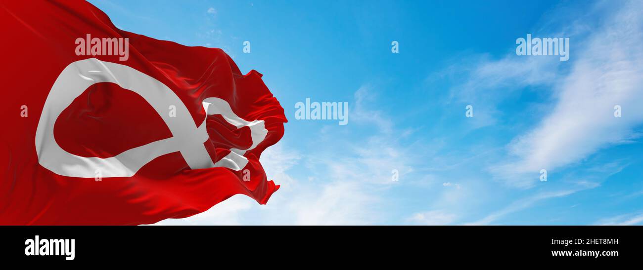 flag of Metis Red , Canada at cloudy sky background on sunset ...