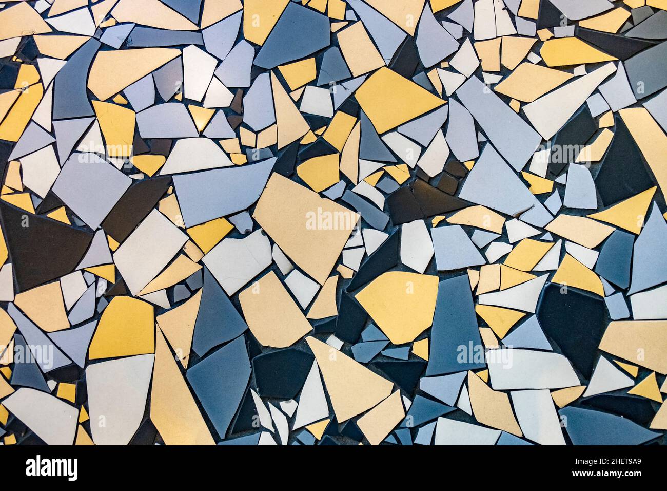 pattern of irregular tiles at the floor gives a harmonic mosaic ...