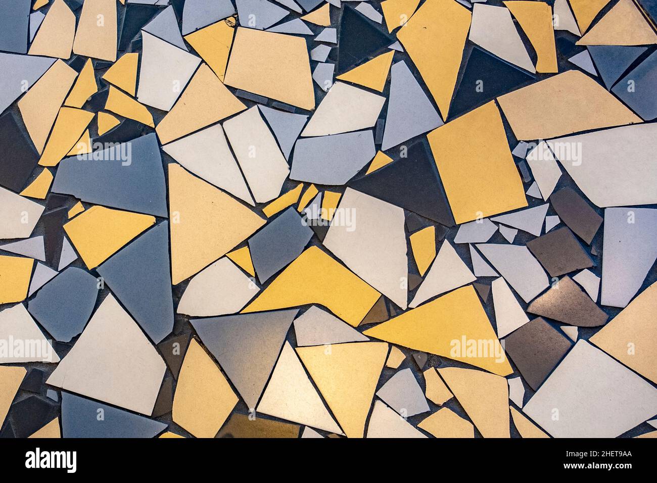 pattern of irregular tiles at the floor gives a harmonic mosaic ...