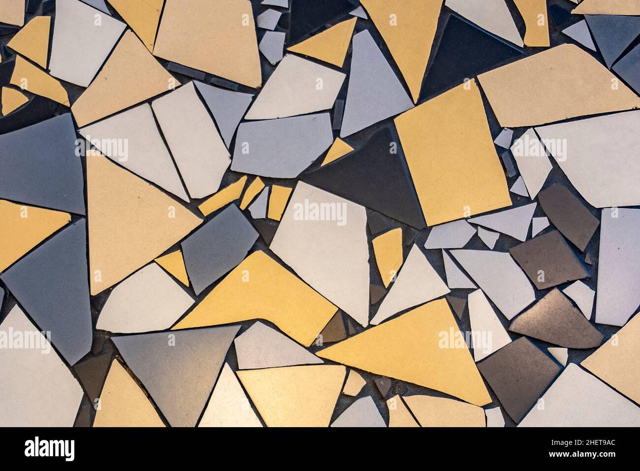 pattern of irregular tiles at the floor gives a harmonic mosaic ...