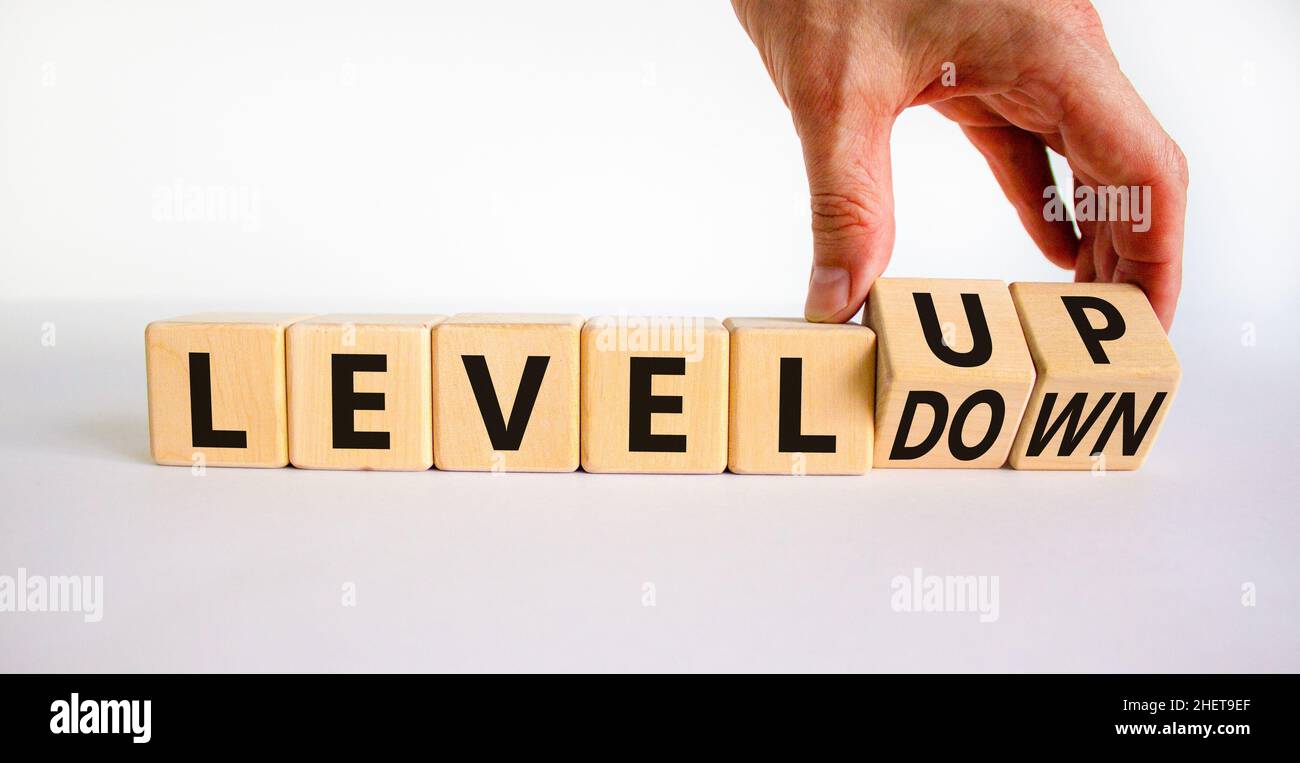 Level up or down symbol. Businessman turns cubes and changes concept ...