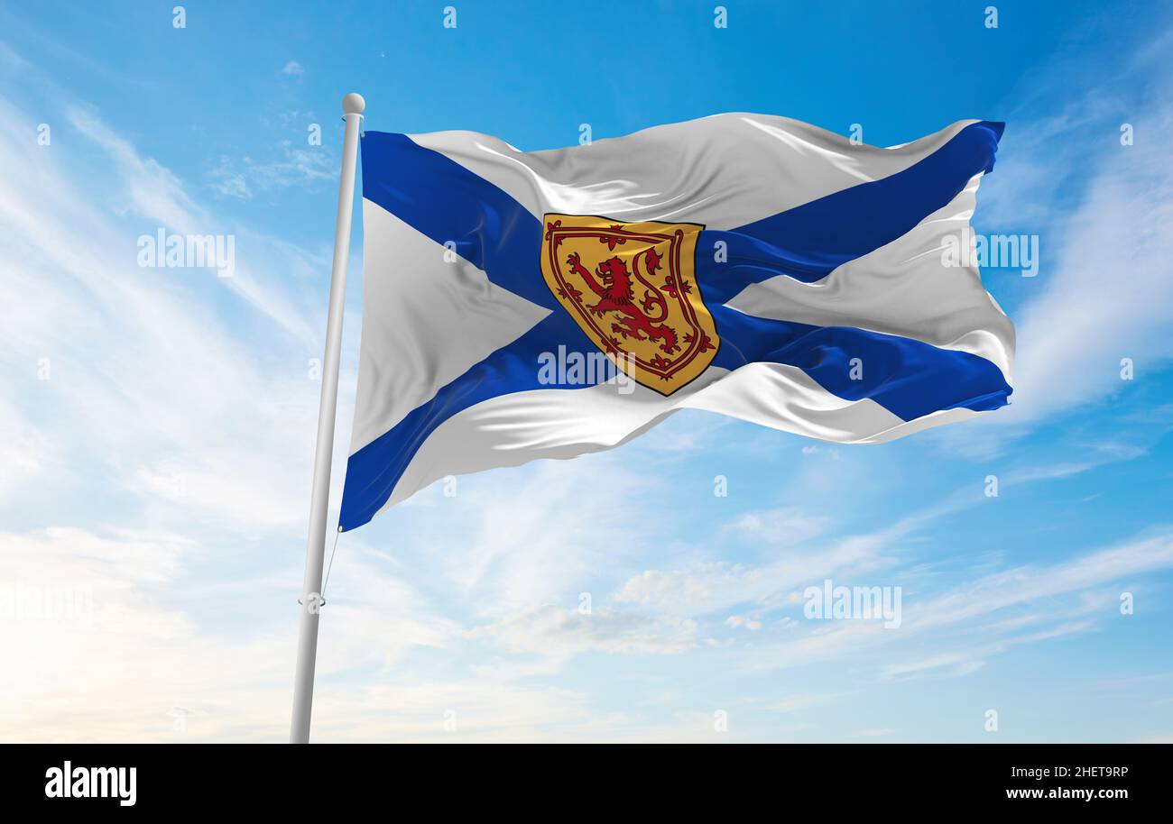 flag of Nova Scotia , Canada at cloudy sky background on sunset ...