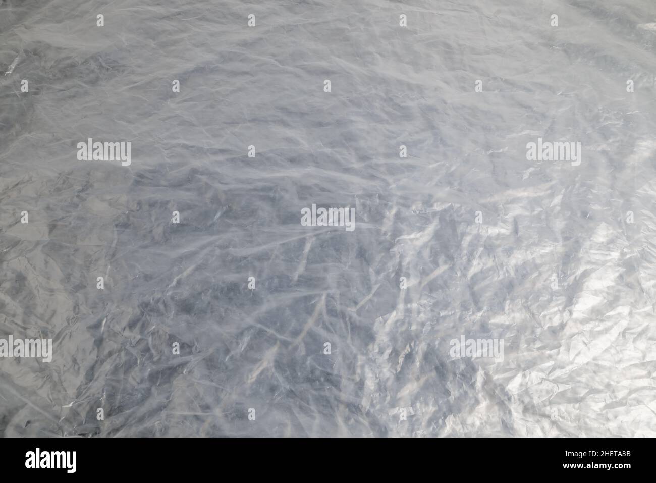 full frame background of flat crumpled semi-transparent polyethylene ...