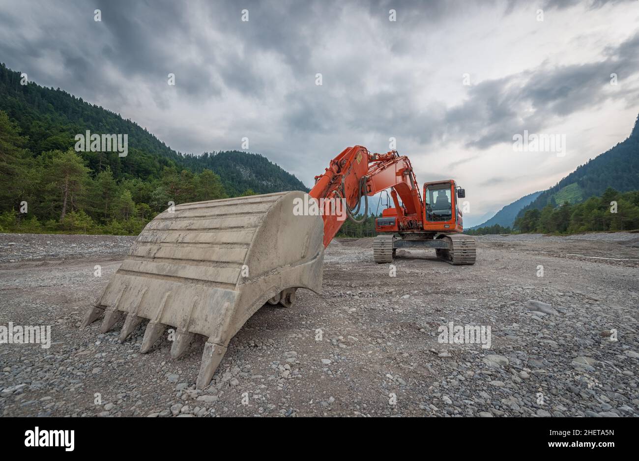 heavy red digger with huge shovel in gravel Stock Photo - Alamy
