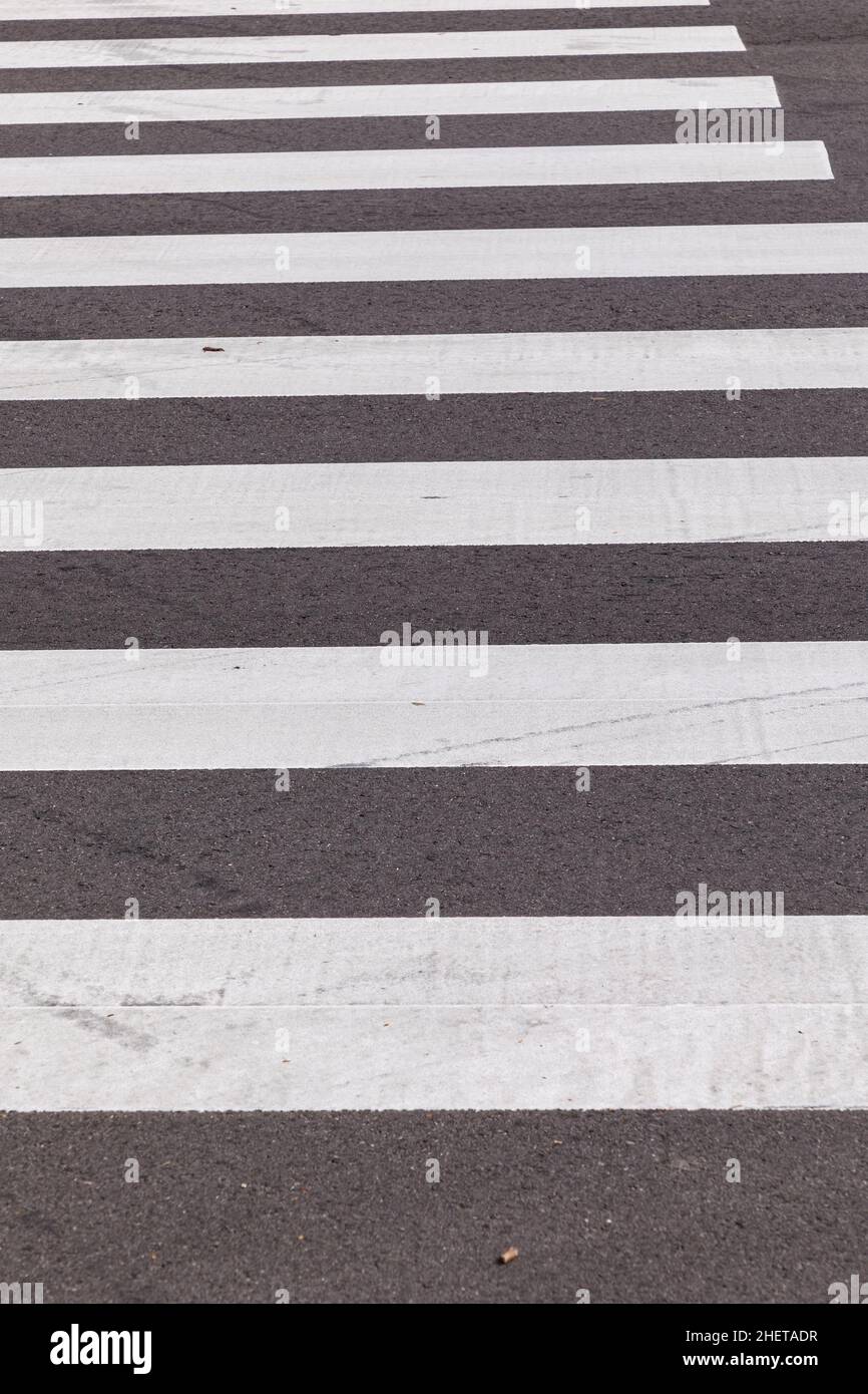 pedestrian crossing in white to symbolize attention to any driver Stock ...