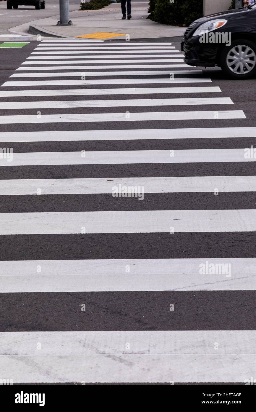pedestrian crossing in white to symbolize attention to any driver Stock ...