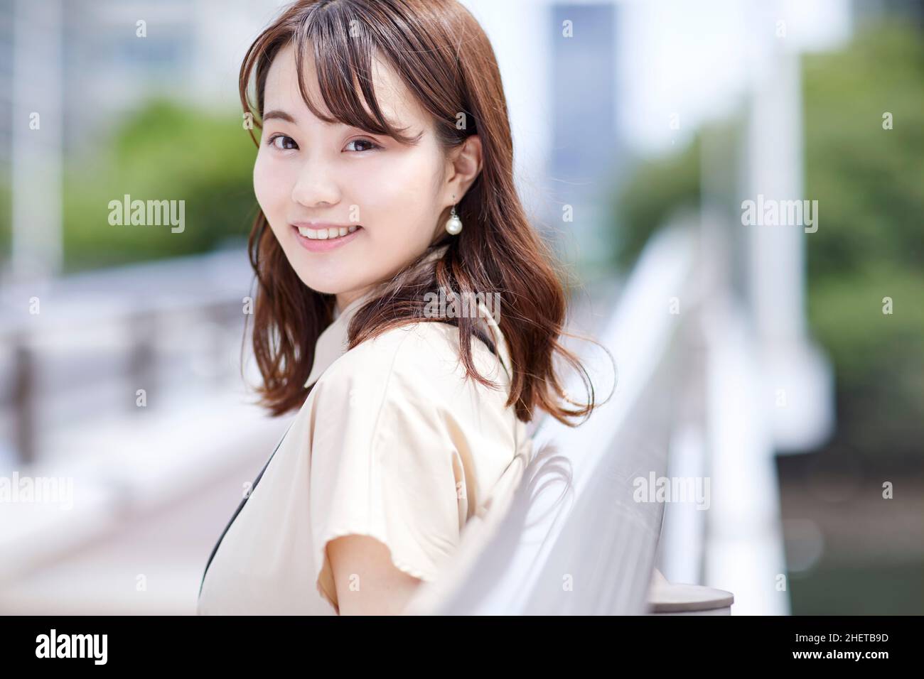 Japanese Woman Looking Back With Smile Stock Photo - Alamy