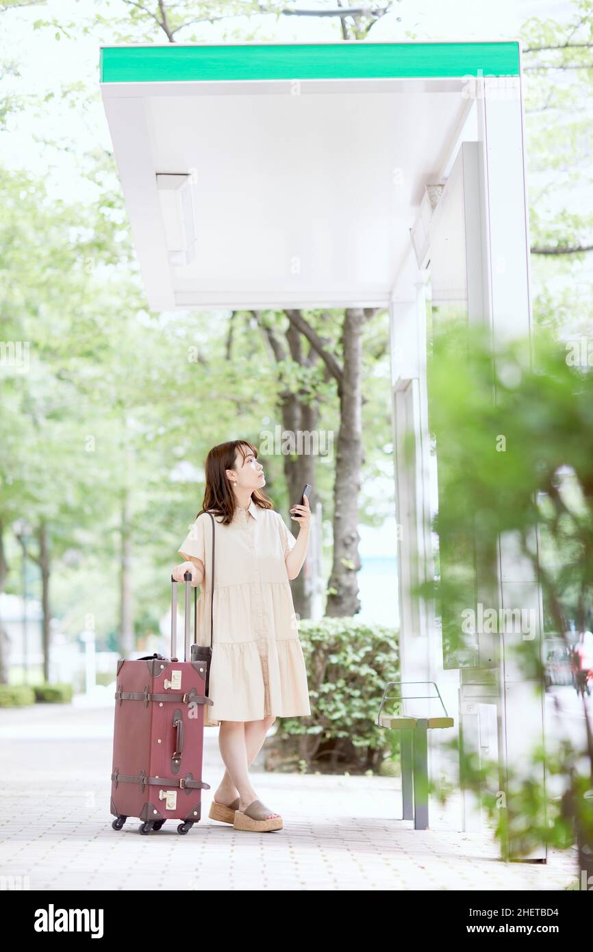 Japanese Woman At Bus Stop Stock Photo - Alamy
