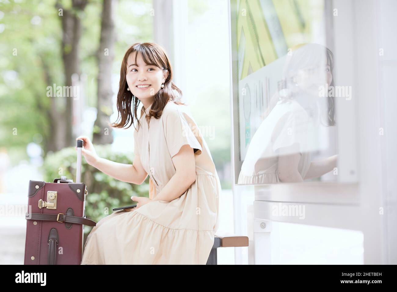 Japanese Woman At Bus Stop Stock Photo - Alamy