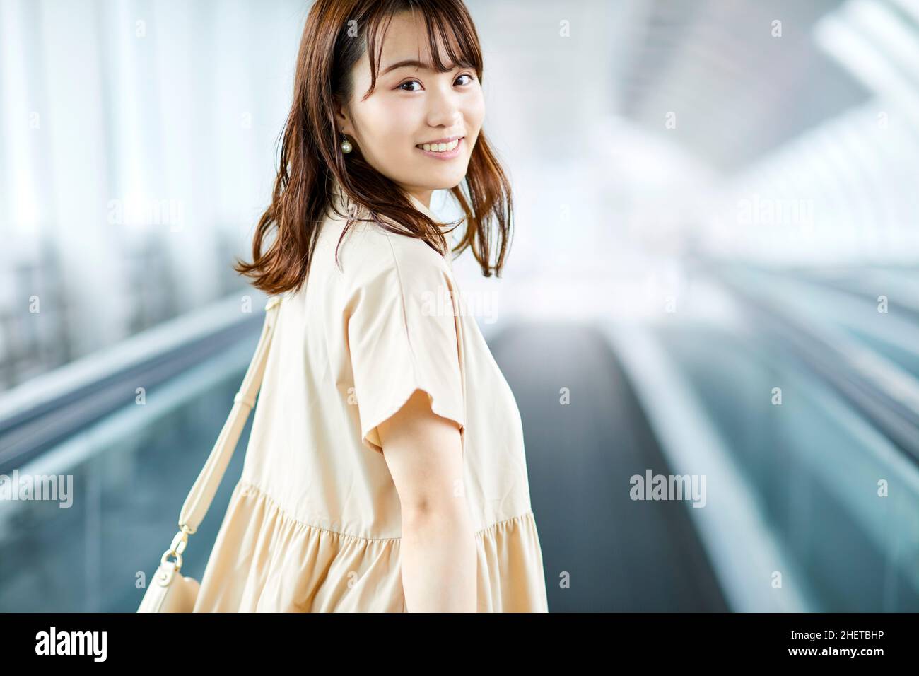 Japanese Woman Looking Back With Smile Stock Photo - Alamy