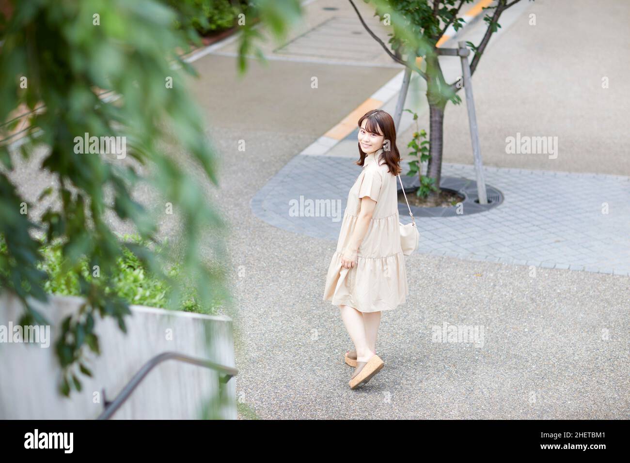 Japanese Woman Looking Back With Smile Stock Photo - Alamy