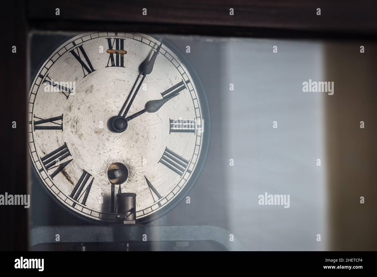 old retro clock with roman numerals behind glass Stock Photo - Alamy